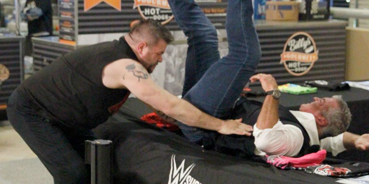 WWE SmackDown: Shane McMahon Gets Powerbombed Through a Merch Table
