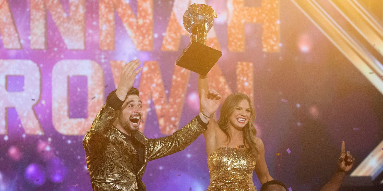 DWTS Winner Alan Bersten Cuddles with His Mirror Ball Trophy