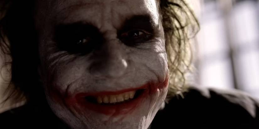 The Dark Knight: How Did The Joker Actually Get His Scars?